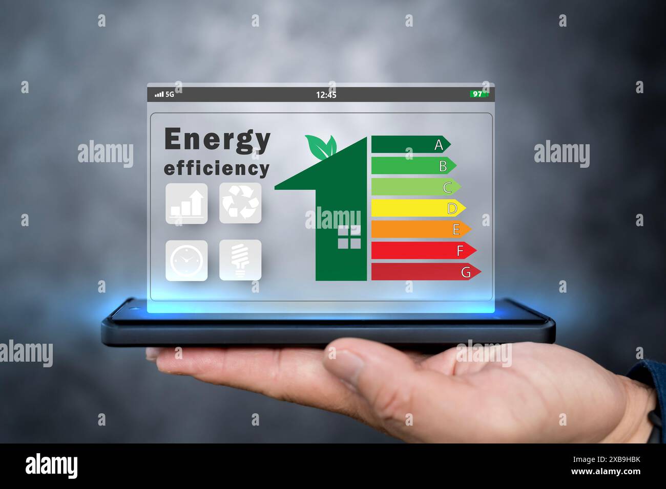 Energy efficiency concept. Person holding energy efficiency rating icon ...
