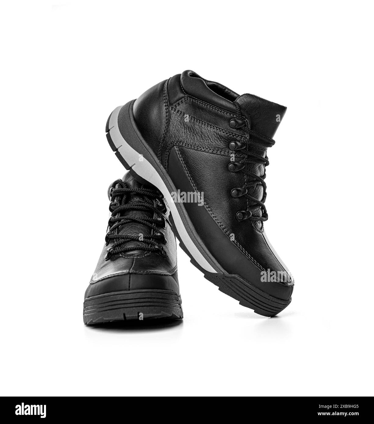 Black winter boots on a white background Stock Photo - Alamy