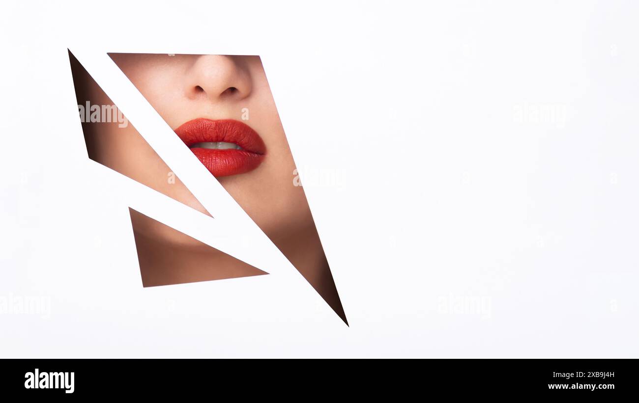 Cropped of Woman Face Revealed Through Hole in Paper Stock Photo - Alamy