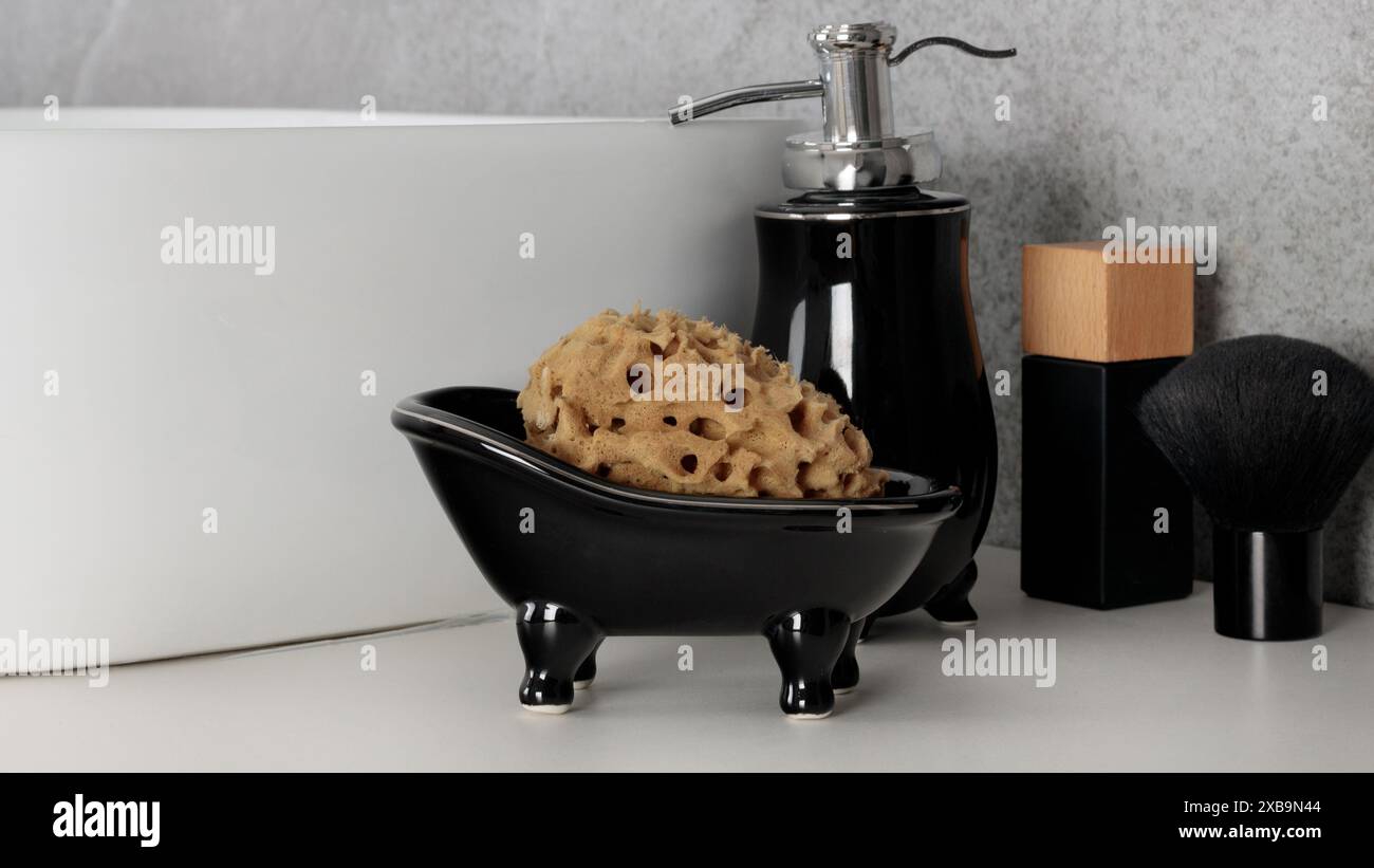 Decorative Sponge in Black Soap Dish Stock Photo - Alamy