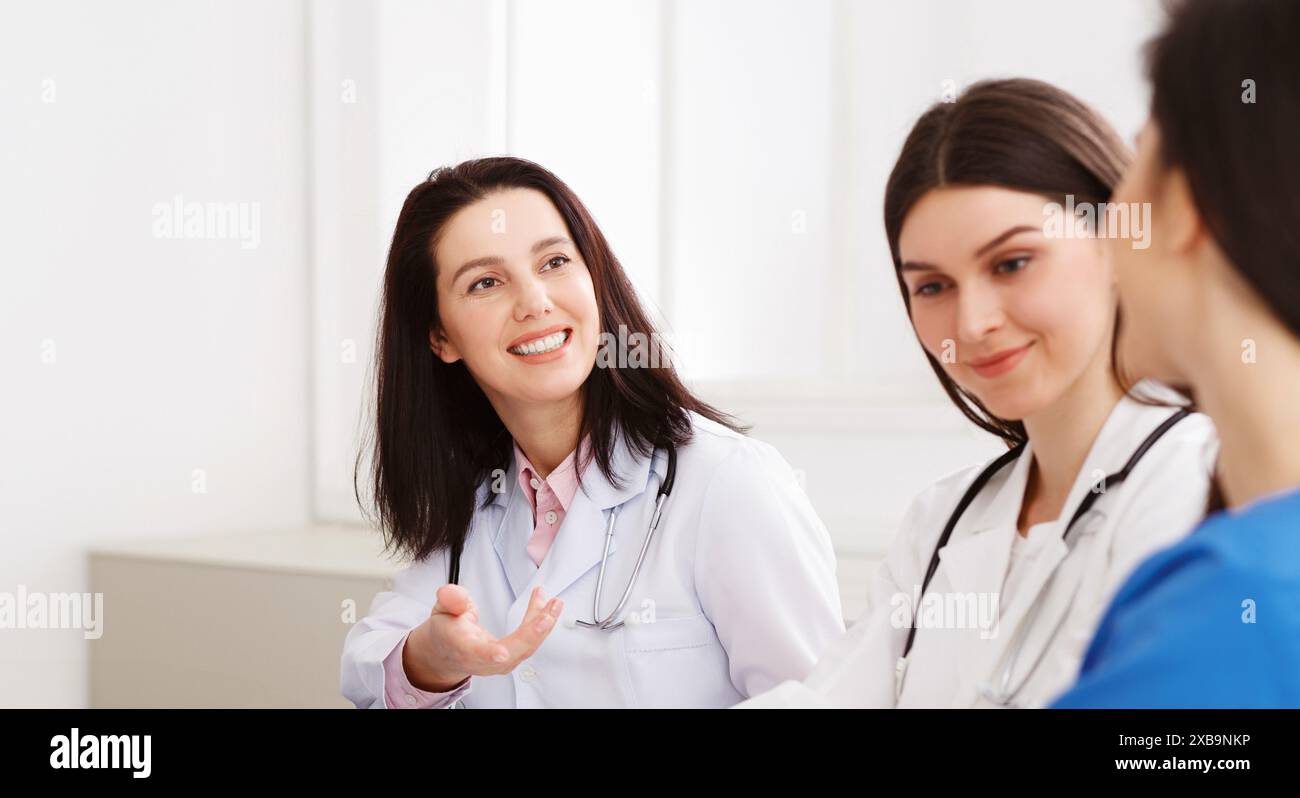 Medical Education. Interns With Mentor Meeting And Taking Notes Stock ...