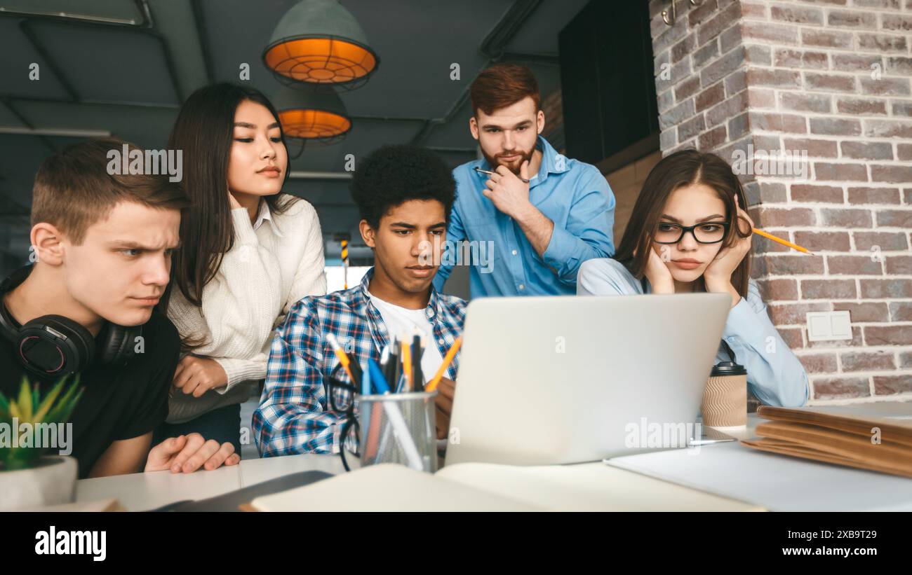 Concentrated classmates doing their project at library together Stock ...