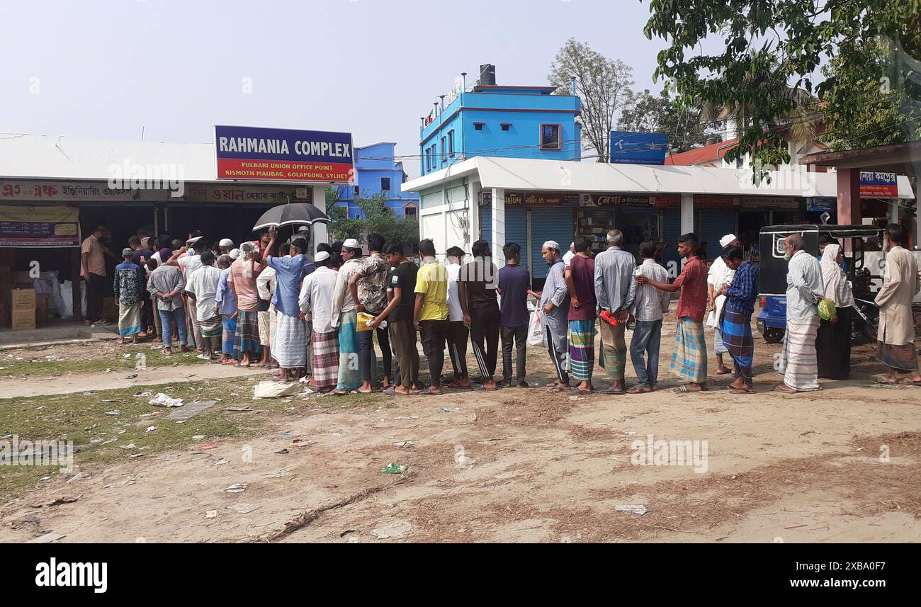 Golapganj, Bangladesh - 28 March 2024 - People standing in line for ...