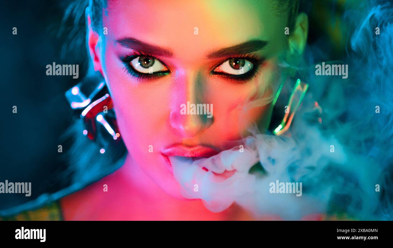 Woman Smoking Cigarette in Front of Colorful Lights Stock Photo - Alamy