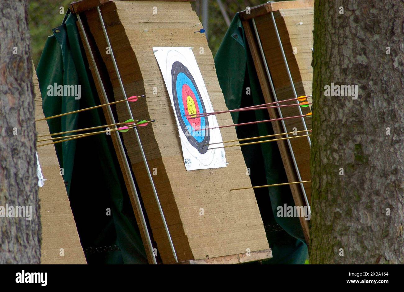 Archer with a bow and arrow aiming in the twilight Archer with bow and ...