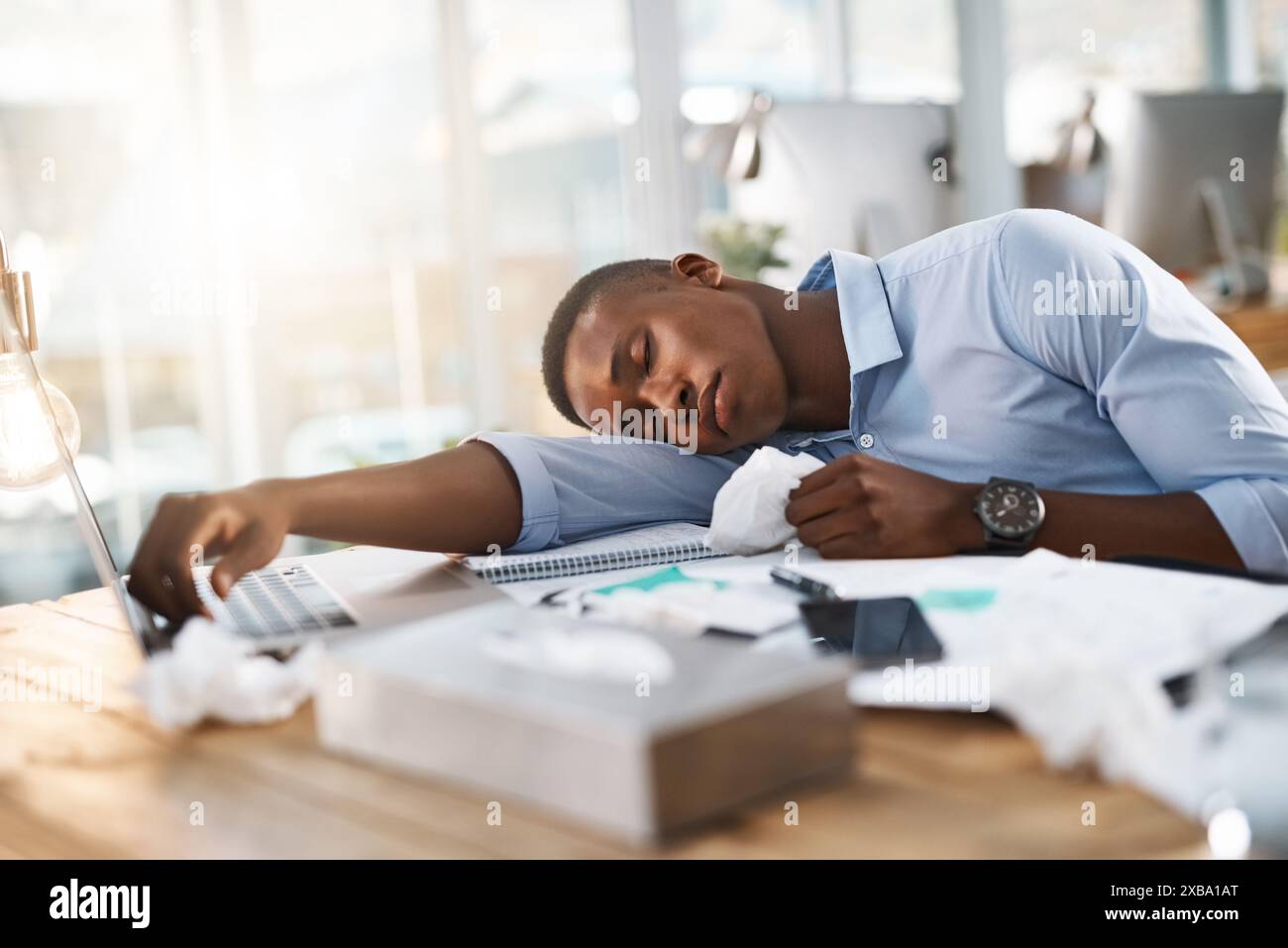 Sleep, sick and black man on desk with flu, allergy and sinusitis or ...