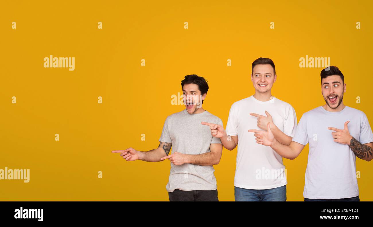 Three men posing with gestures on yellow background Stock Photo - Alamy