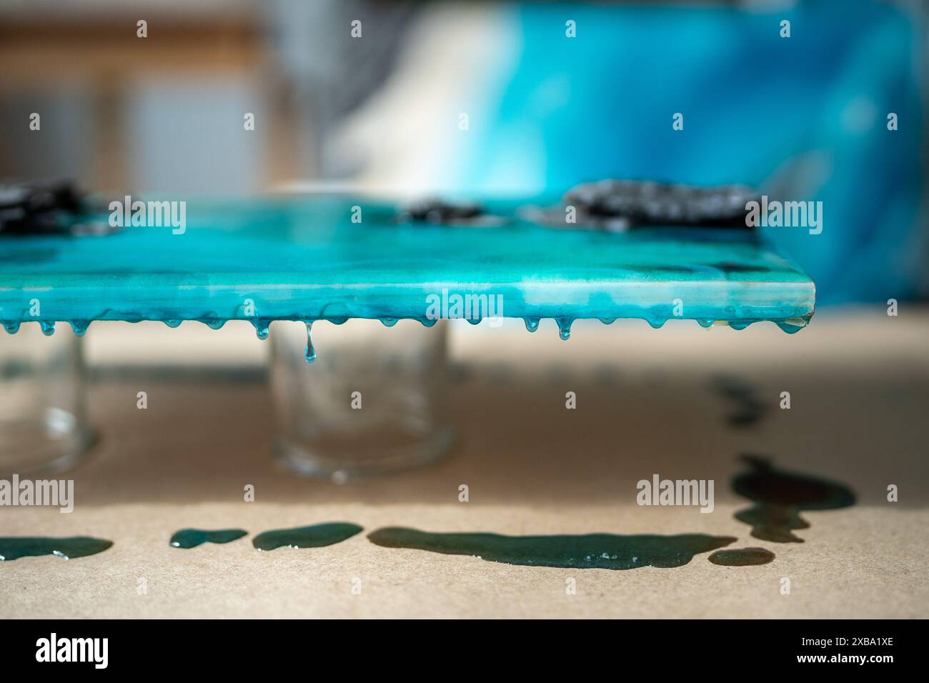 Drops of epoxy resin drip from canvas. Drying hardening of painting ...