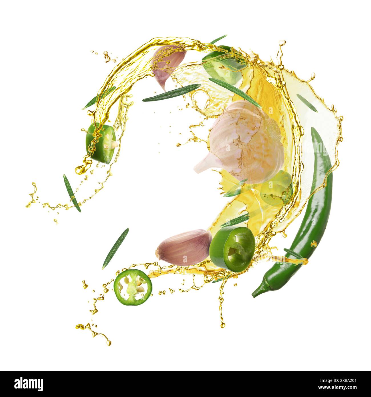 Cooking oil splash with chili pepper, garlic and rosemary in air on ...