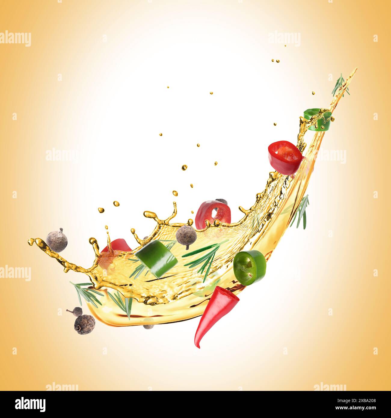 Cooking oil splash with chili peppers, rosemary and allspice in air on ...