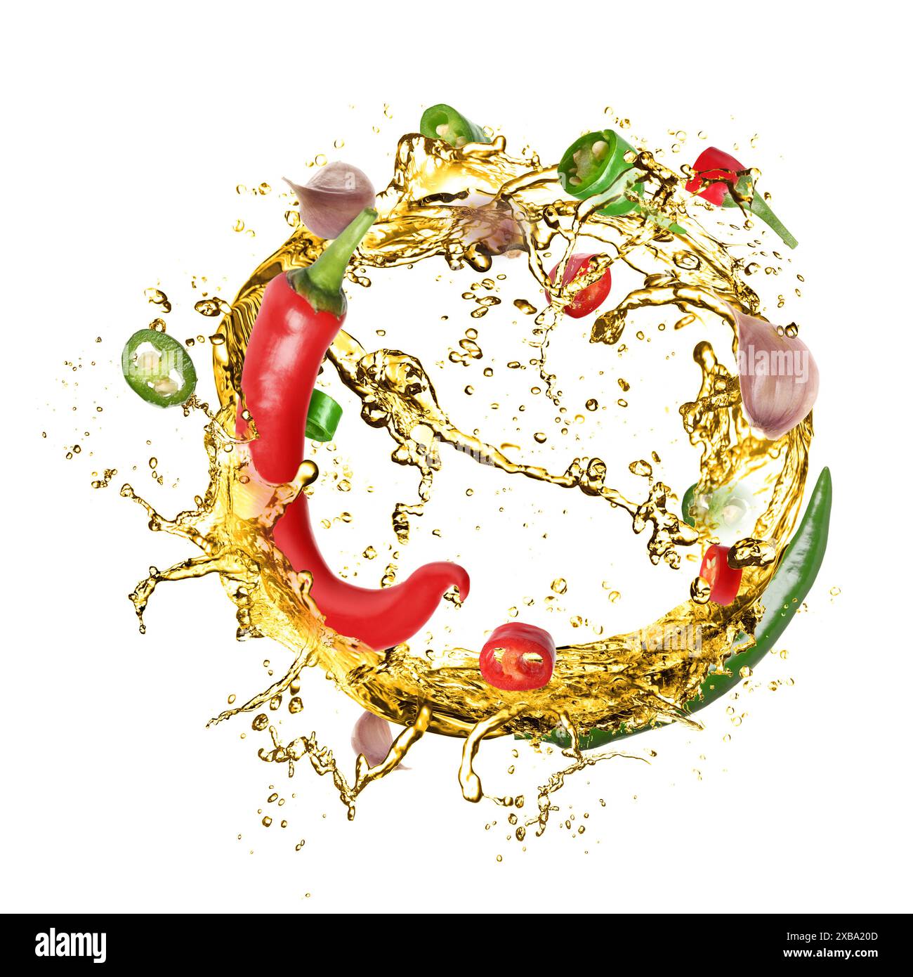 Cooking oil splash with chili peppers and garlic in air on white ...
