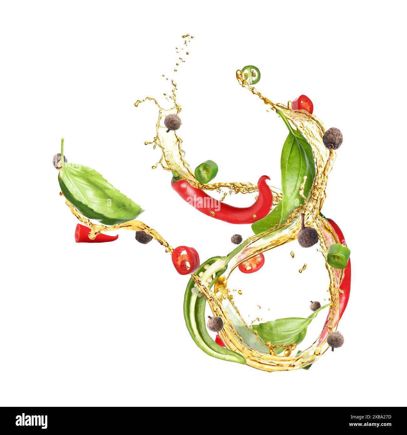 Cooking oil splash with chili peppers, basil and allspice in air on ...