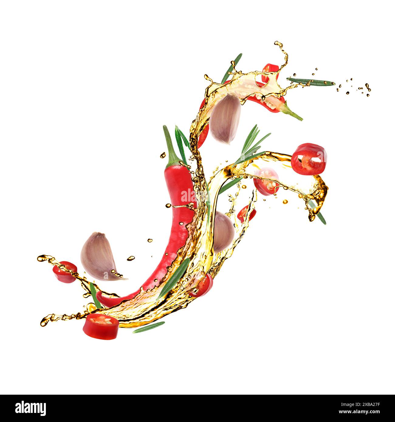 Cooking oil splash with chili pepper, rosemary and garlic in air on ...
