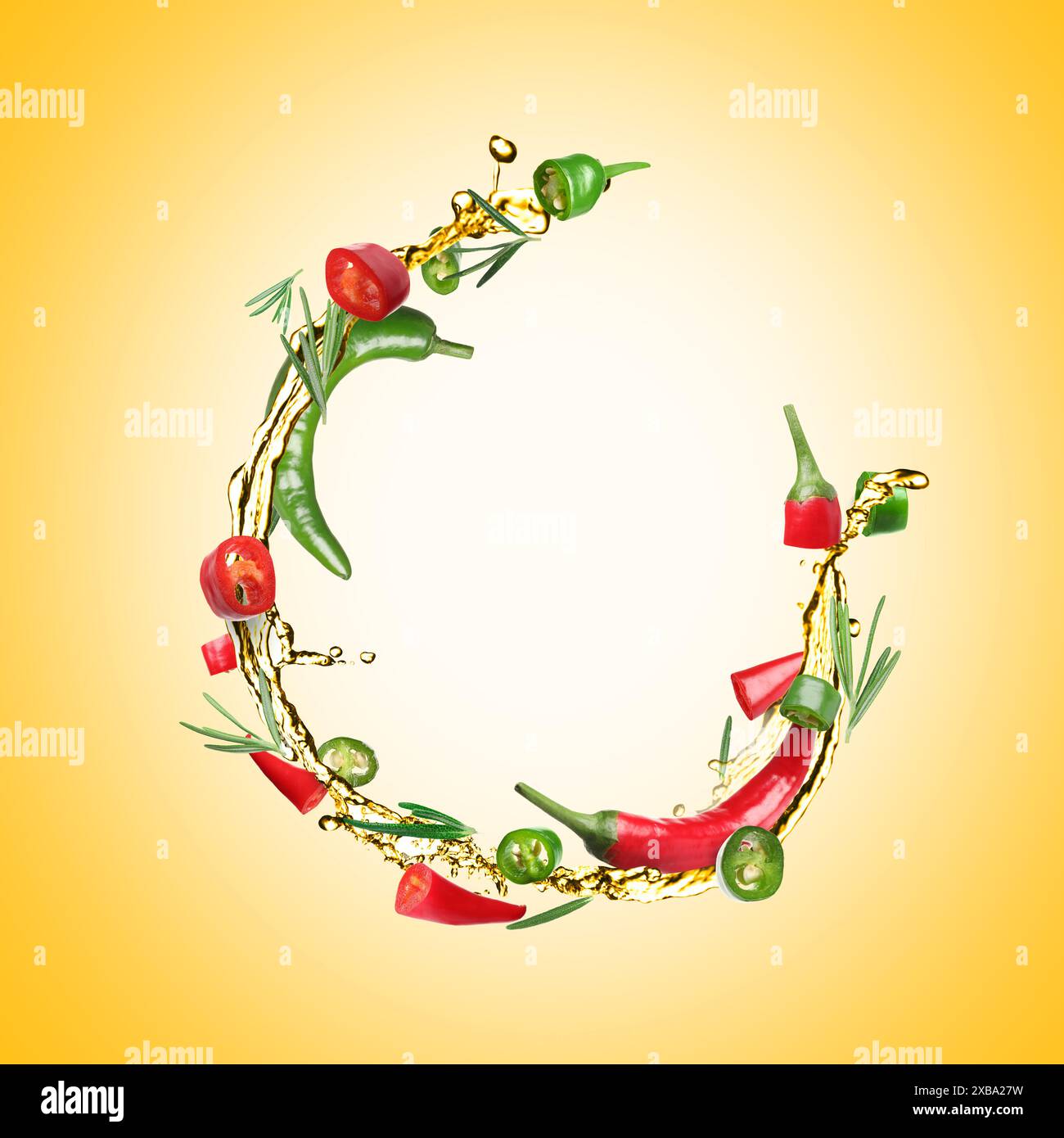 Cooking oil splash with chili peppers and rosemary in air on golden ...