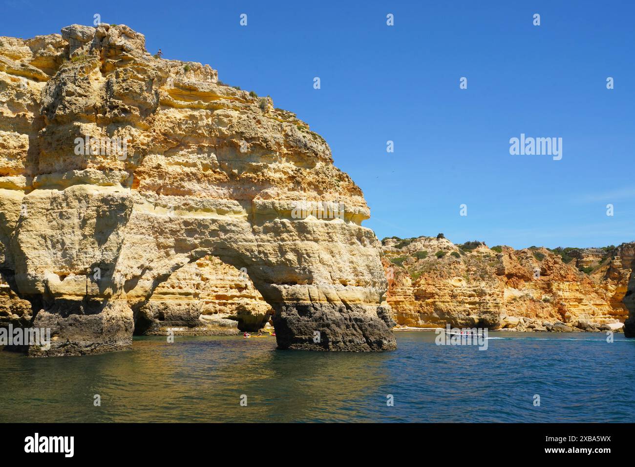 Arch on rocky cliffs near Benagil Caves on Algarve coast of Portugal ...