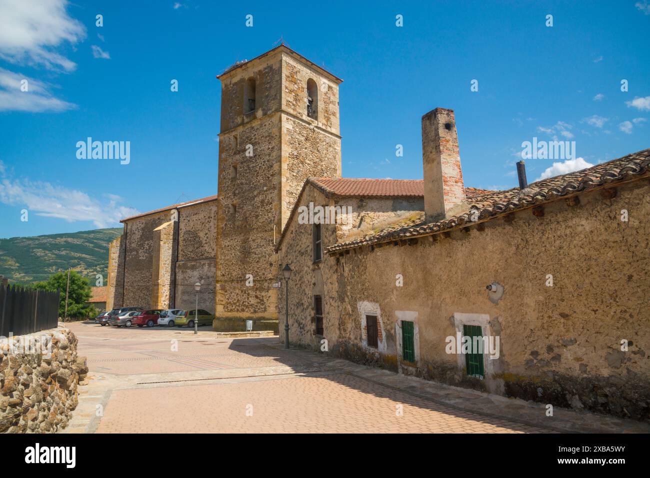 Street and San Miguel Arcangel church. Pinilla del Valle, Madrid ...