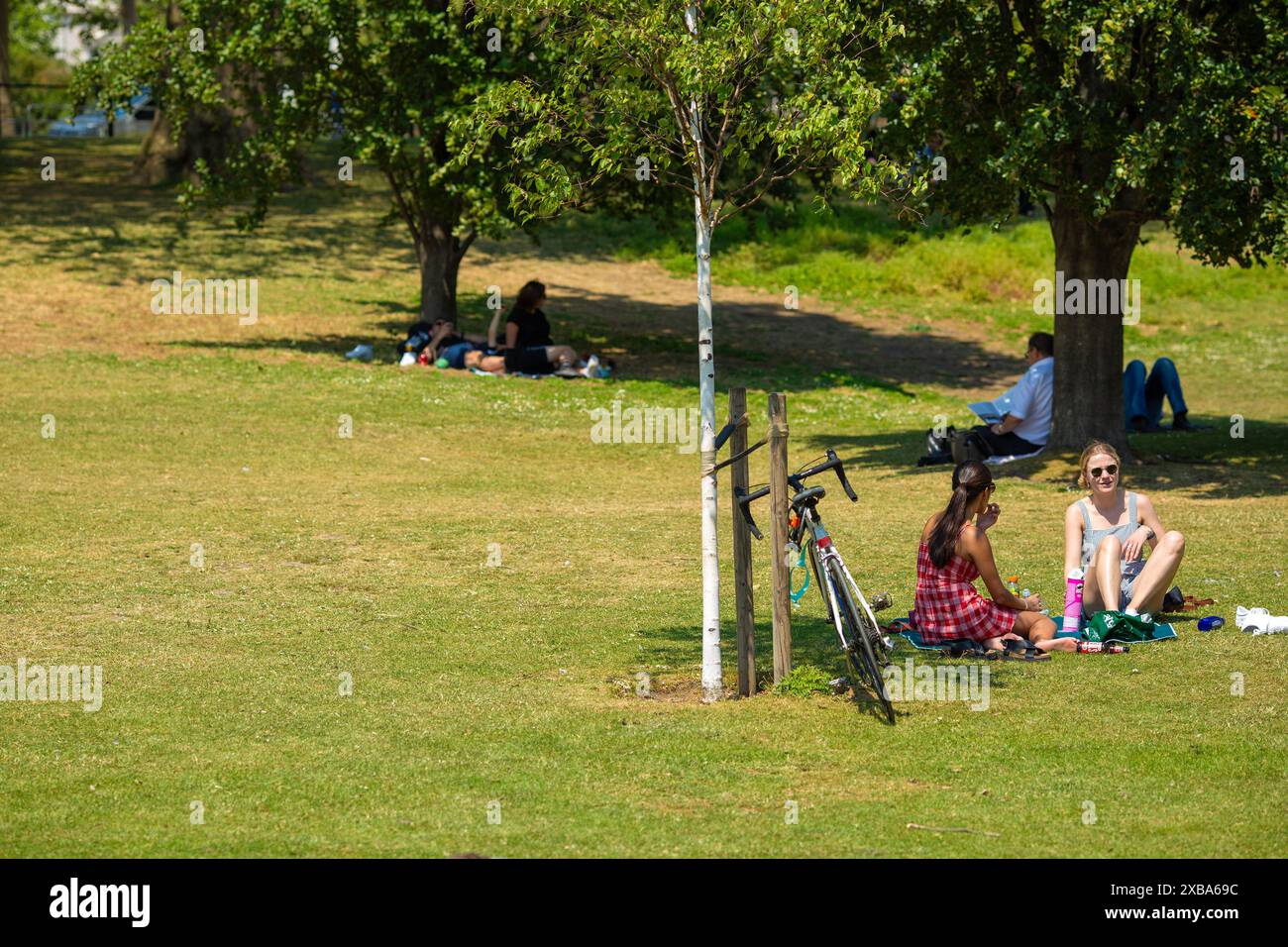 People enjoy a spell of hot weather as some sunbathe and others avoid ...
