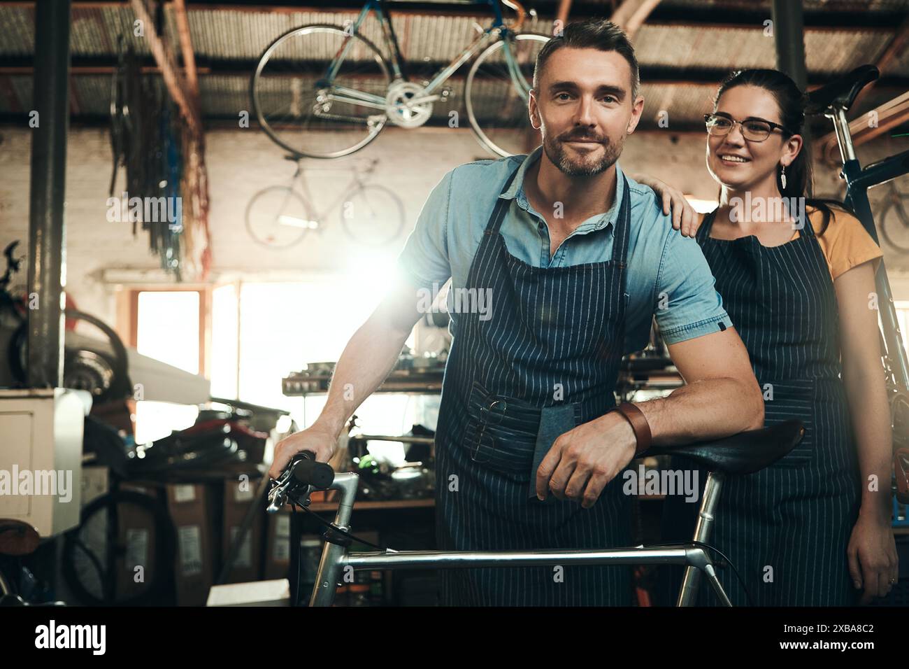 Man, woman and bicycle shop with smile for maintenance job, startup ...