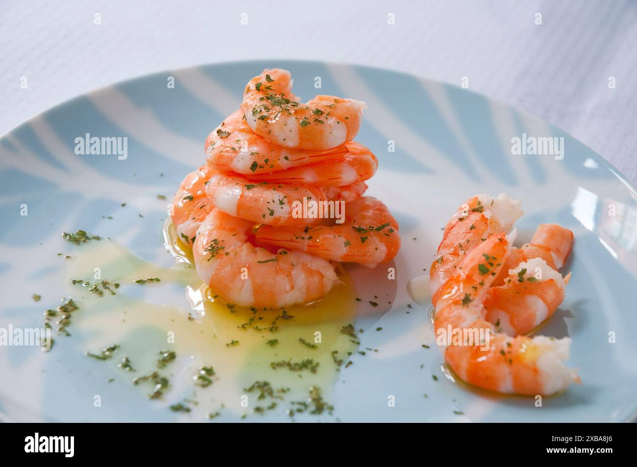 Piled prawns with olive oil and parsley. Spain Stock Photo - Alamy