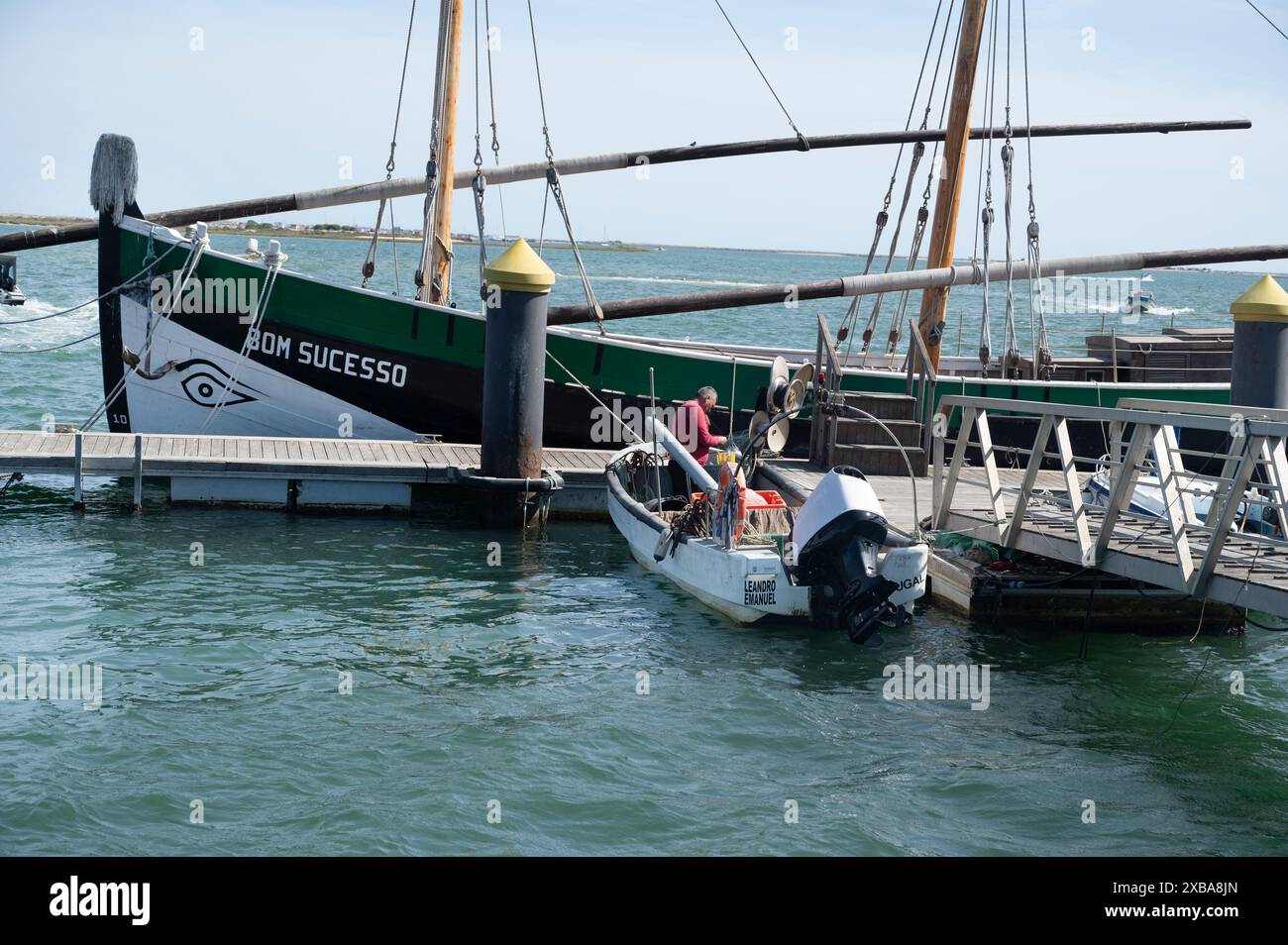 Portugal, Olhao, Algarve May 2024. Fishing boat and small speed boat in ...