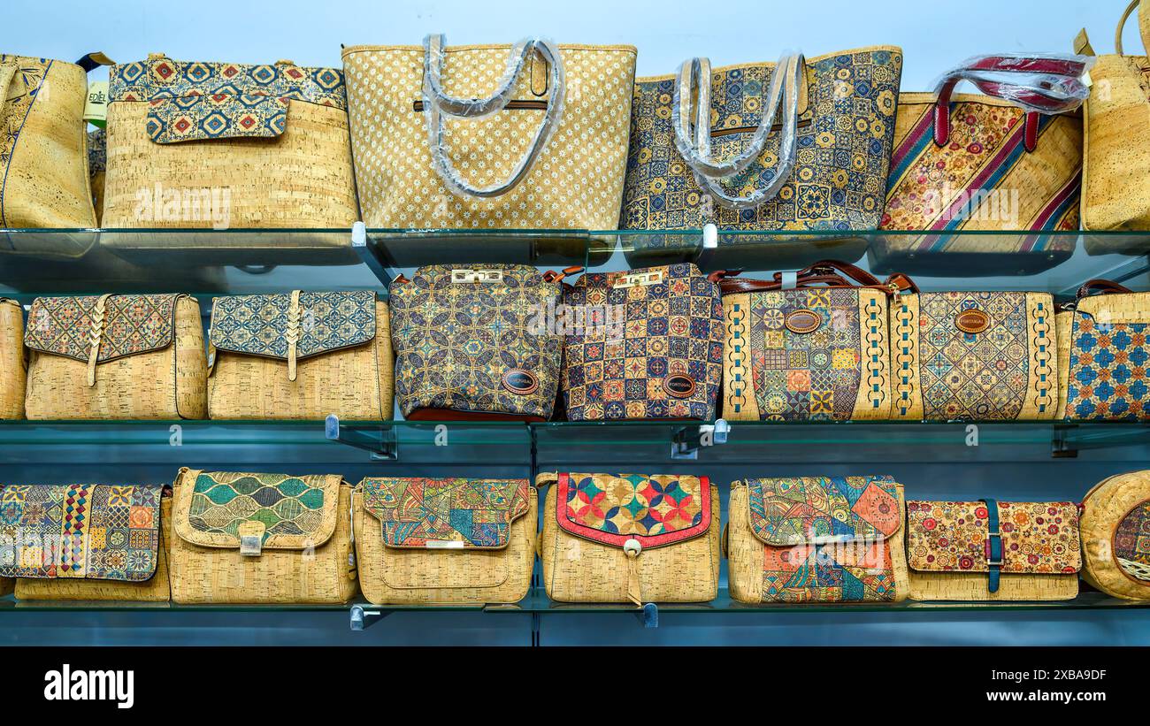 The retail display of cork purses with the word "Portugal". They are ...