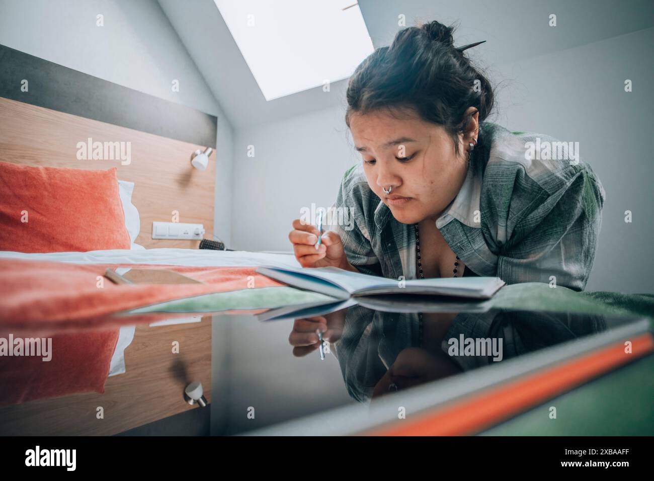 typical study moment where a student uses both her tablet and notebook ...