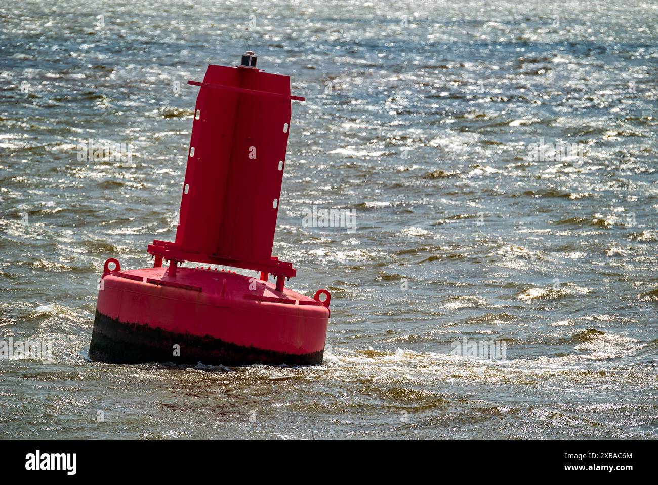 Shipping navigation buoy in sparkling waters Stock Photo - Alamy