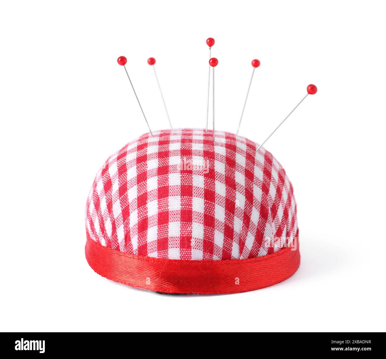 Red pincushion with sewing pins isolated on white Stock Photo - Alamy
