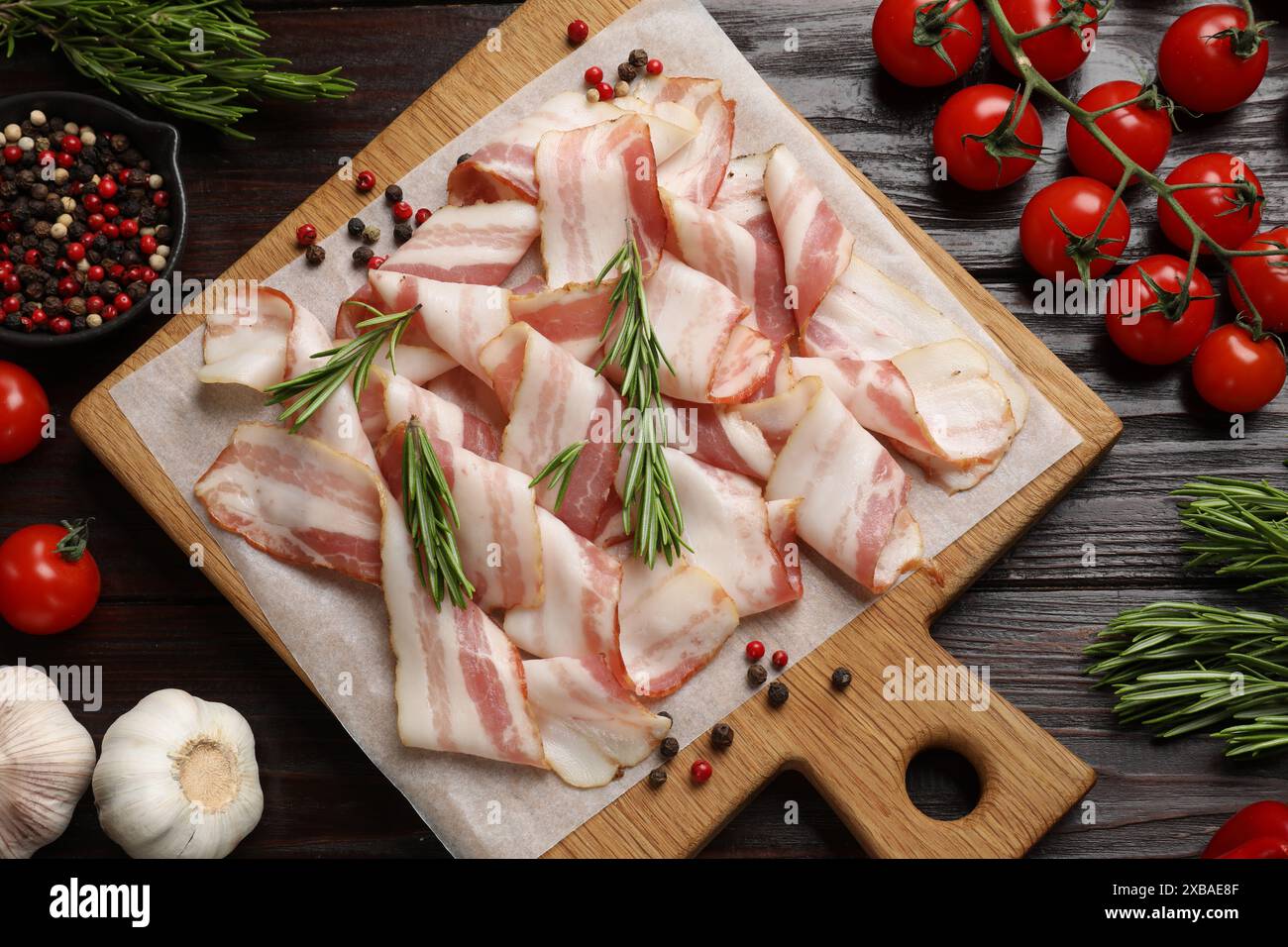Slices of raw bacon and fresh products on wooden table, flat lay Stock ...