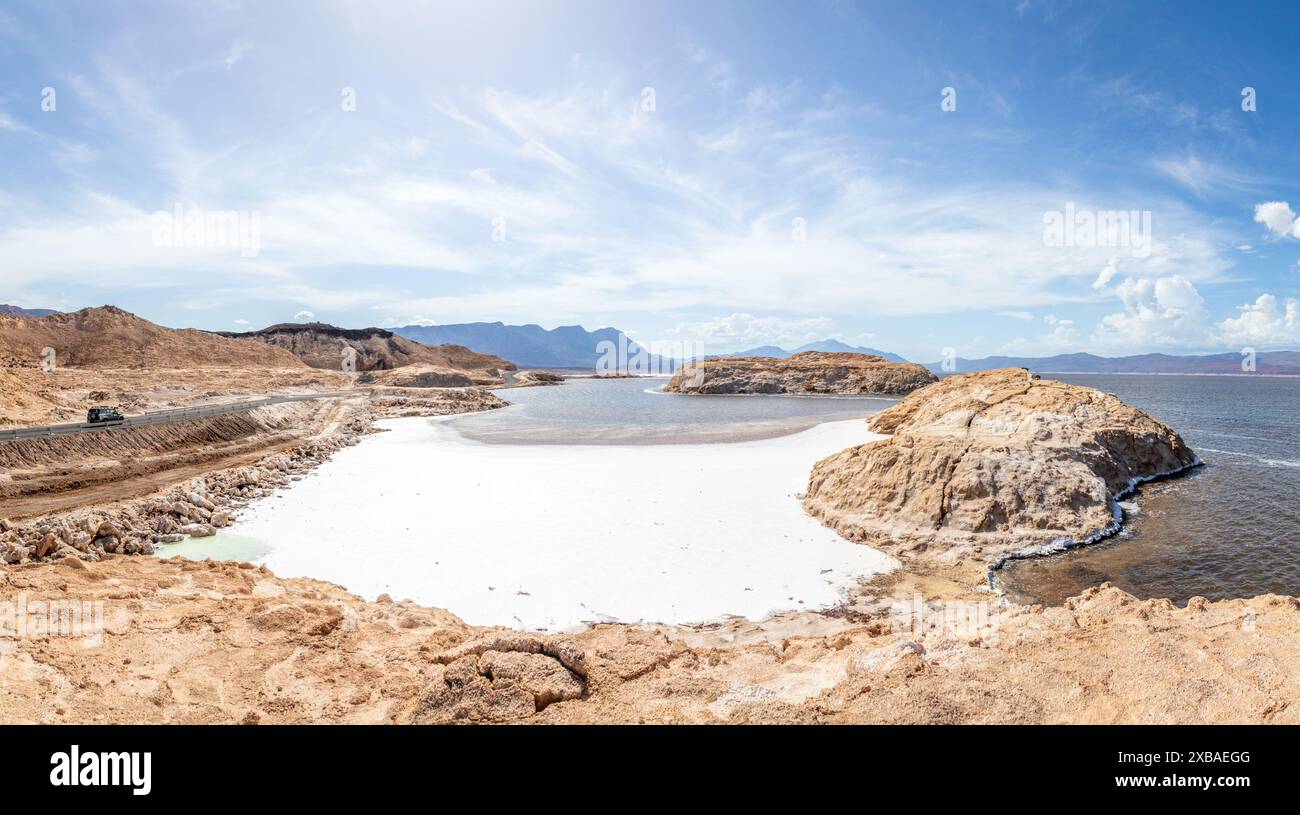 Lac Assal salt lake waters with islands in the middle and salt crust ...