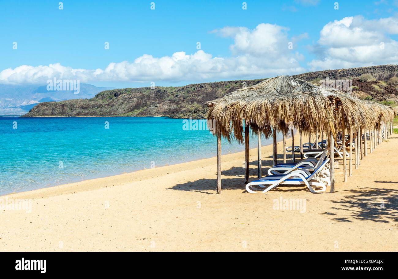 Sable Blanc sand beach with straw huts and turquoise colored sea ...
