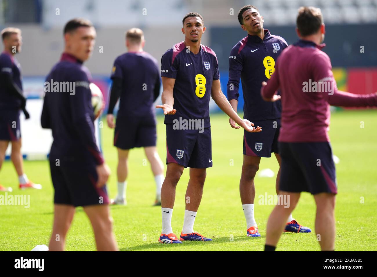 England players Trent Alexander-Arnold and Jude Bellingham react during a training session at ...