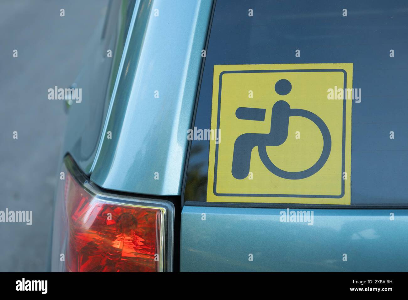 Attention sign, person with disability inside. Yellow and black sticker ...