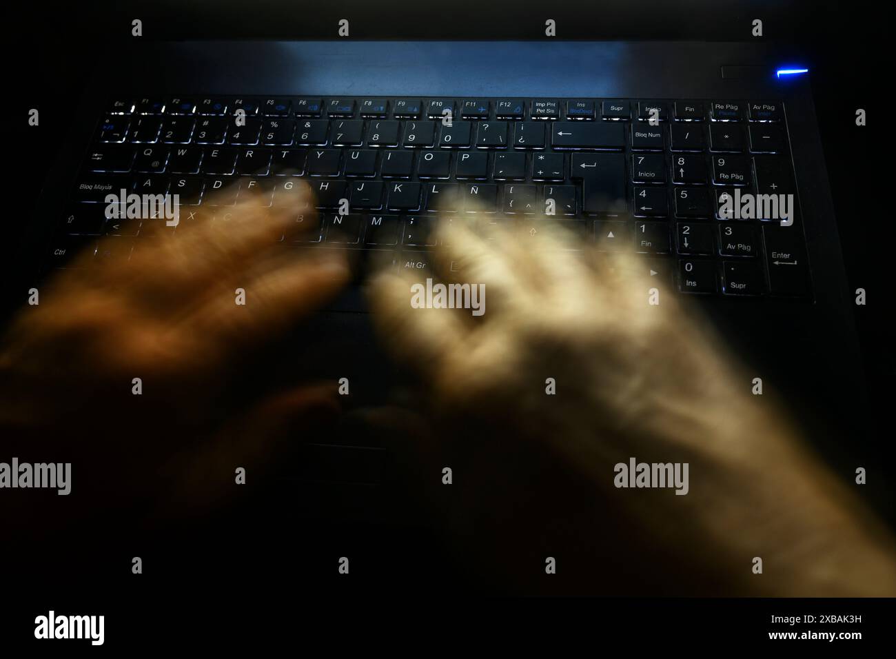 man hands typing at night on backlit PC keyboard Stock Photo - Alamy