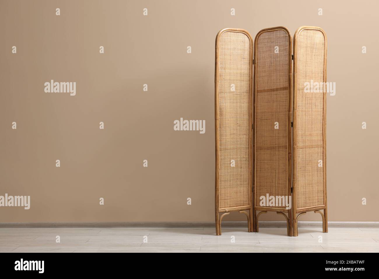 One folding screen near beige wall indoors, space for text Stock Photo ...