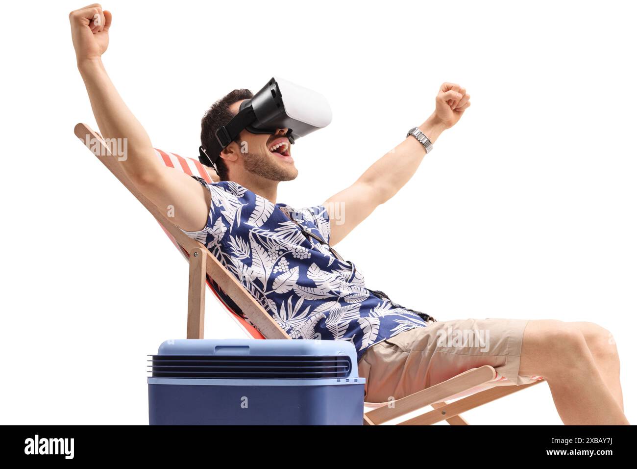 Man on a deck chair using a VR headset gesturing happiness isolated on ...