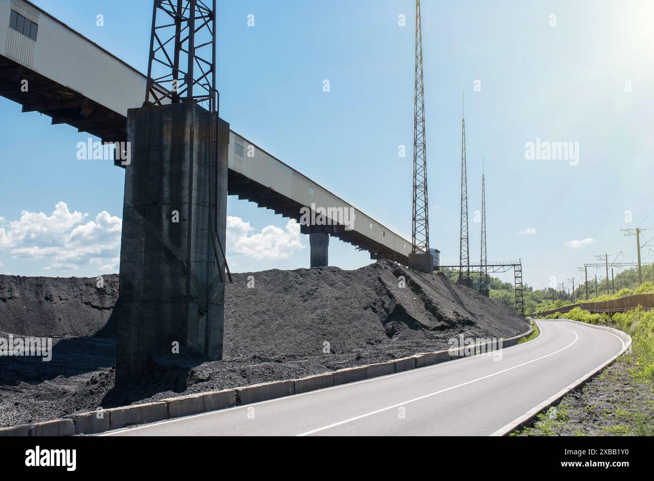 Coal mining and coal storage in a warehouse. Heavy industrial coal ...