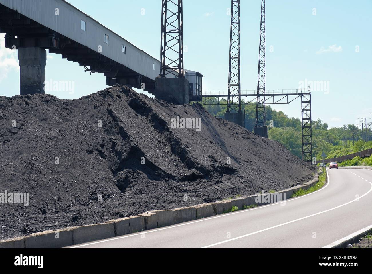 Heaps of coal. Storage and facilities of the coal industry Stock Photo ...