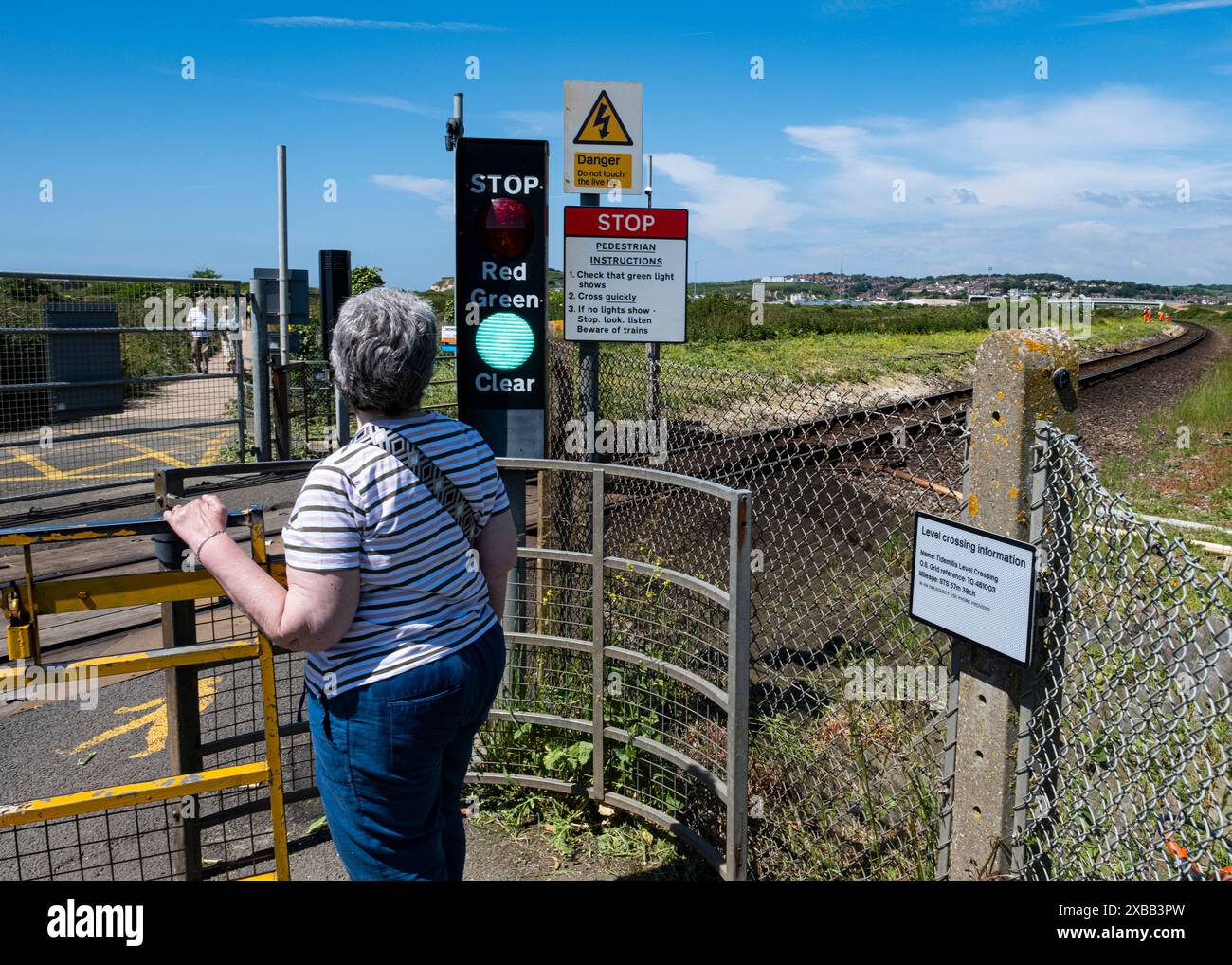 Lady crossing railway line hi-res stock photography and images - Alamy