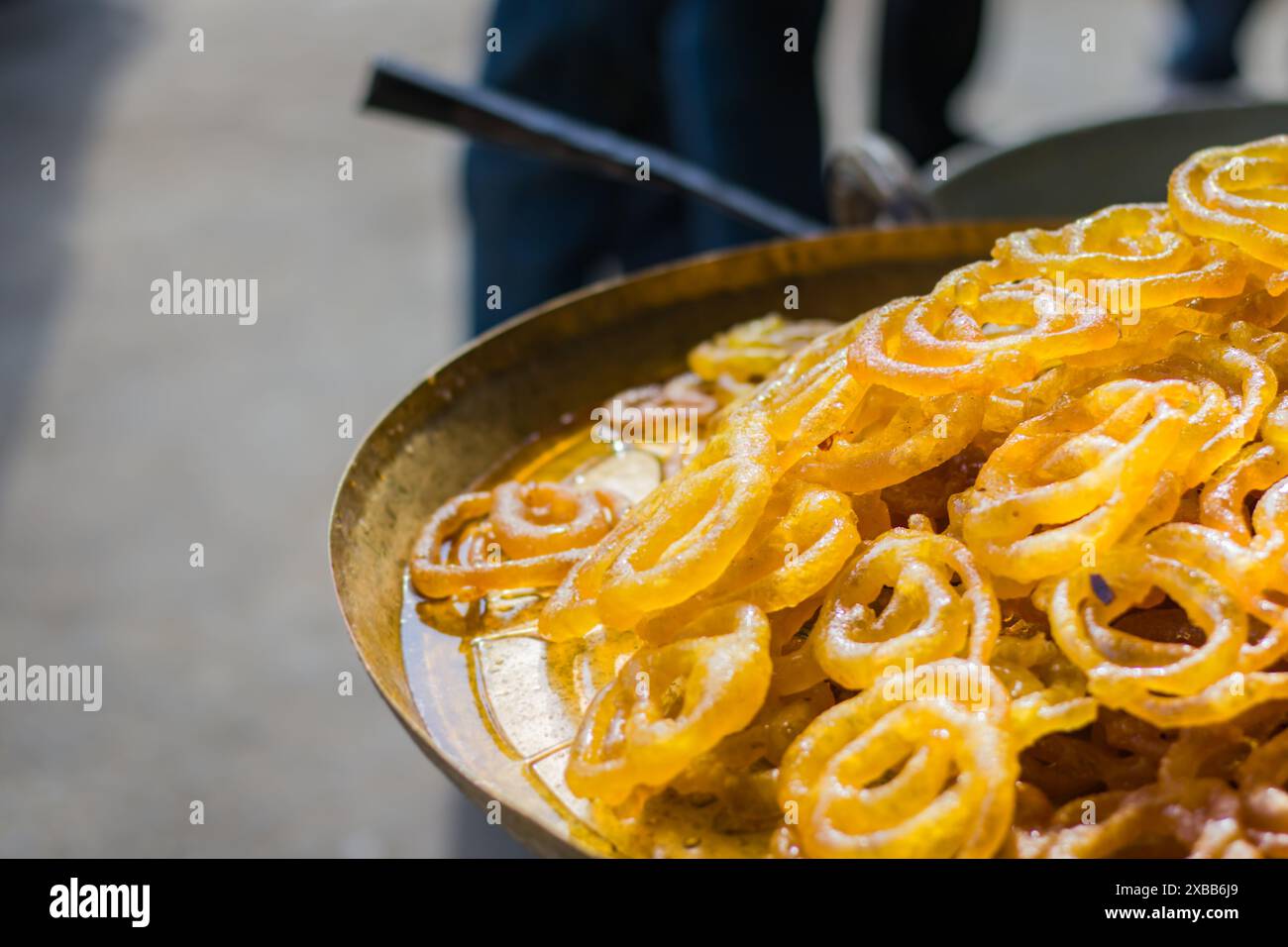 Jalebi or jilipi, freshly cooked and kept on tray for hindu festival of ...