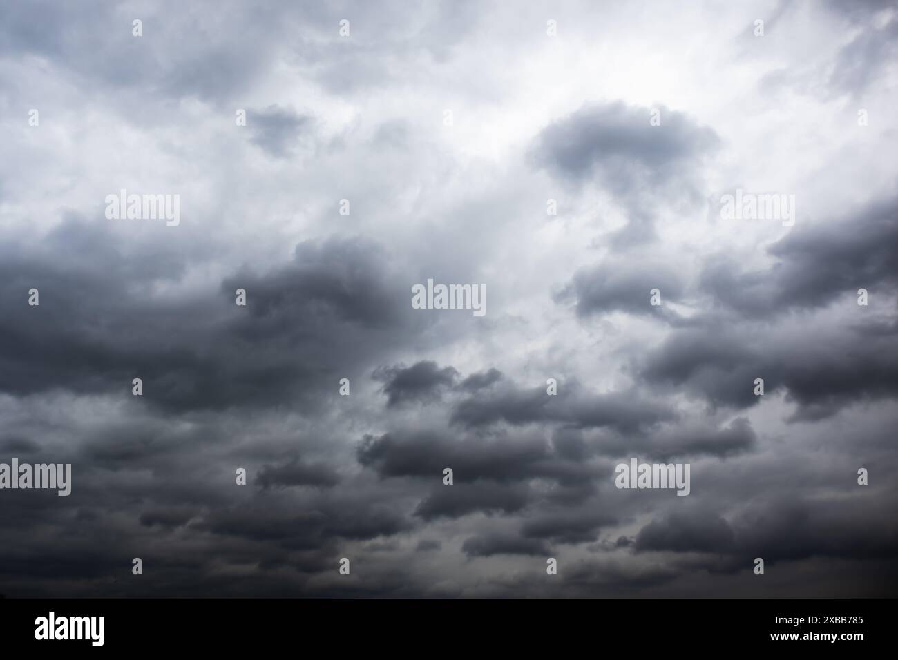 dark rain clouds moving during cyclone storm over urban cities in ...