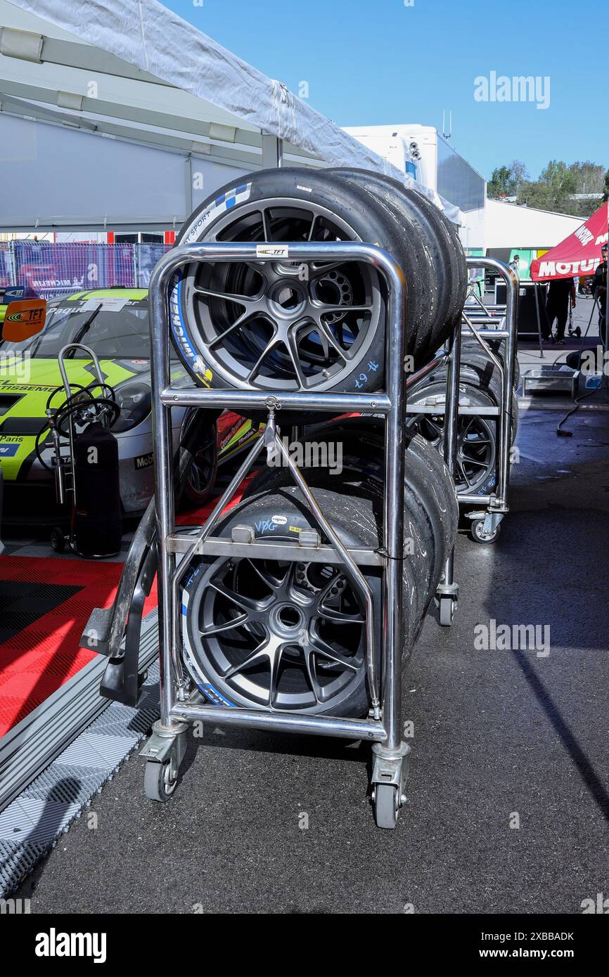 European Le Mans car race wheels and tyres in a stack in the paddock at ...
