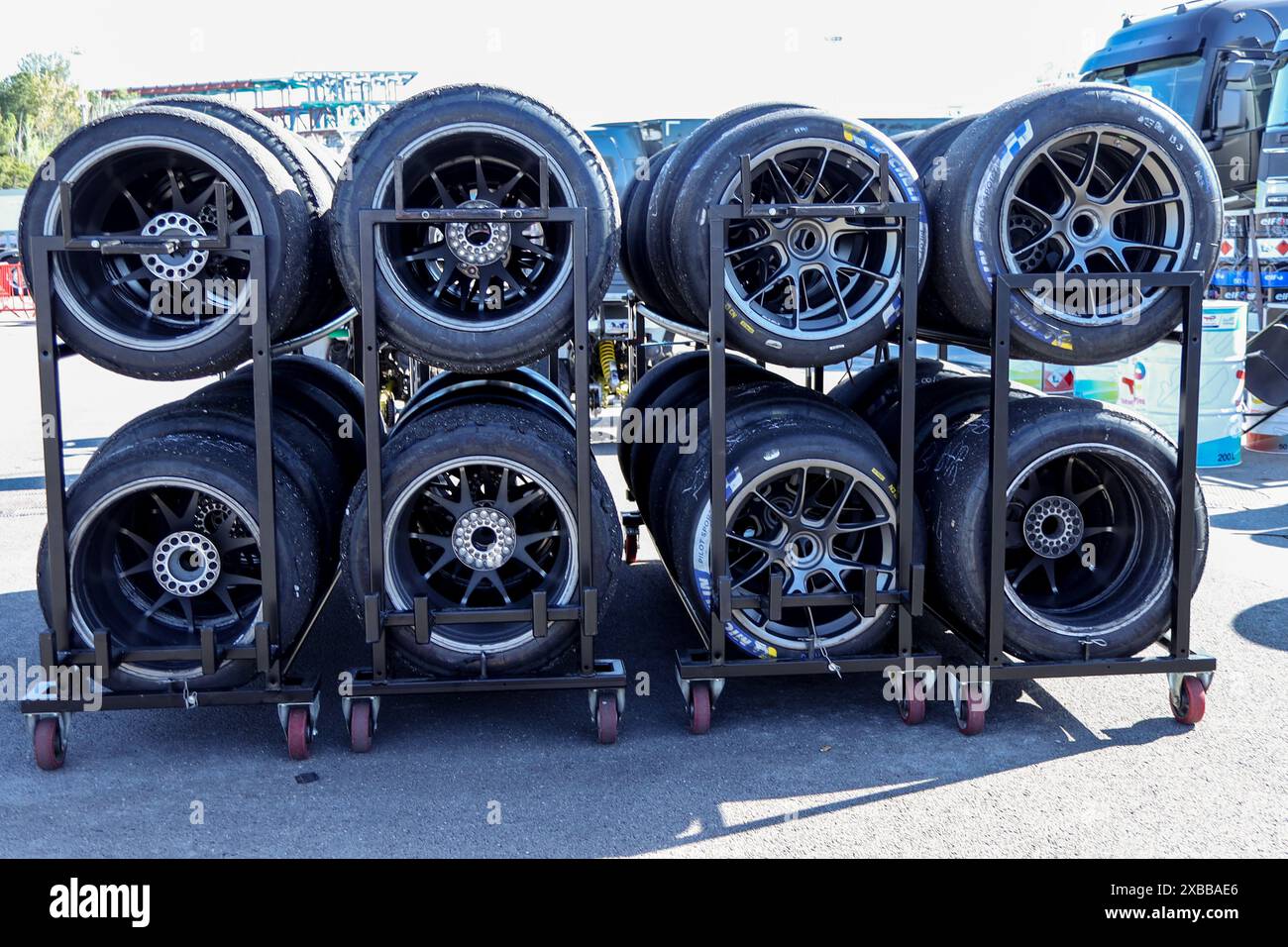 European Le Mans car race wheels and tyres in a stack in the paddock at ...