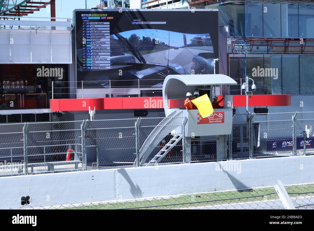 Yellow flag being waved by race Marshall at the 2024 Barcelona European ...
