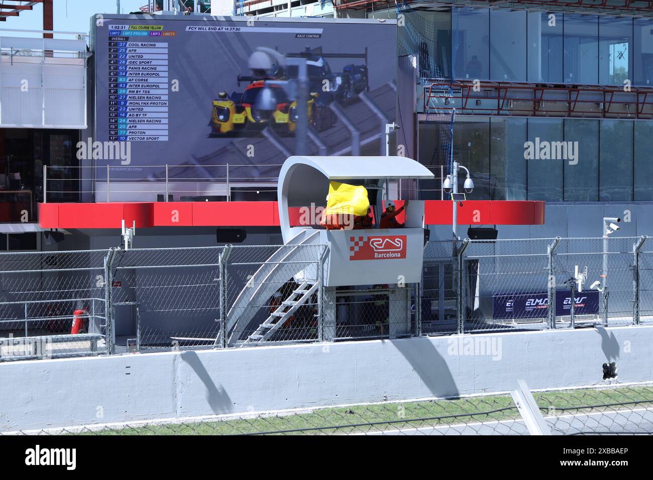 Yellow flag being waved by race Marshall at the 2024 Barcelona European ...