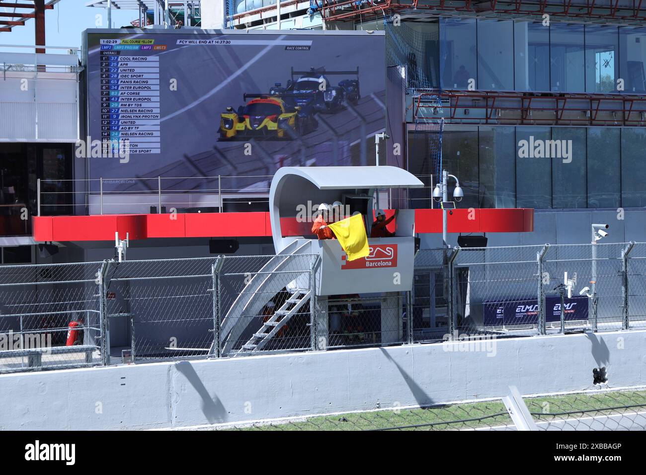 Yellow flag being waved by race Marshall at the 2024 Barcelona European ...