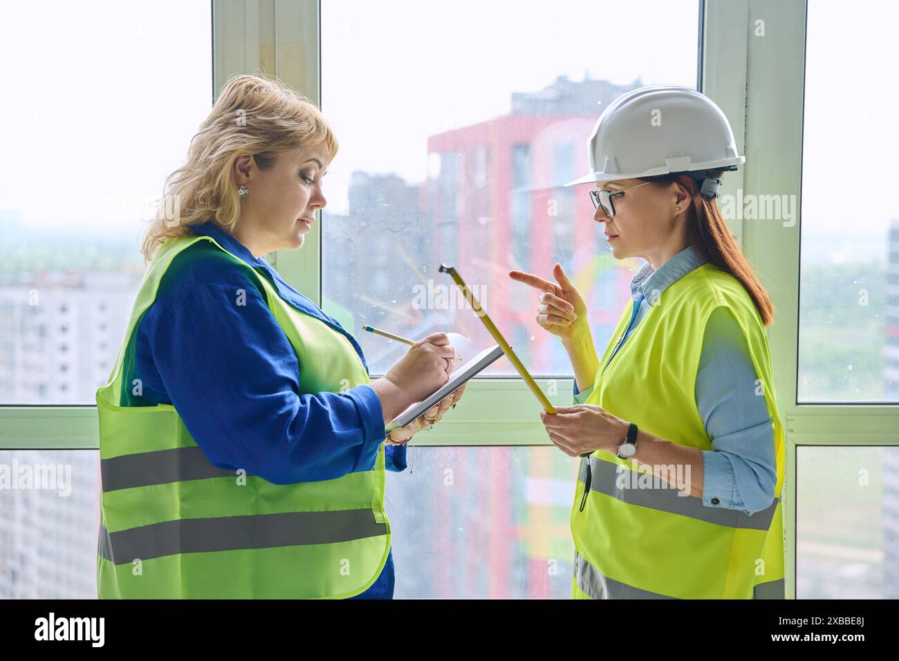 Two workers measurements windows hi-res stock photography and images ...