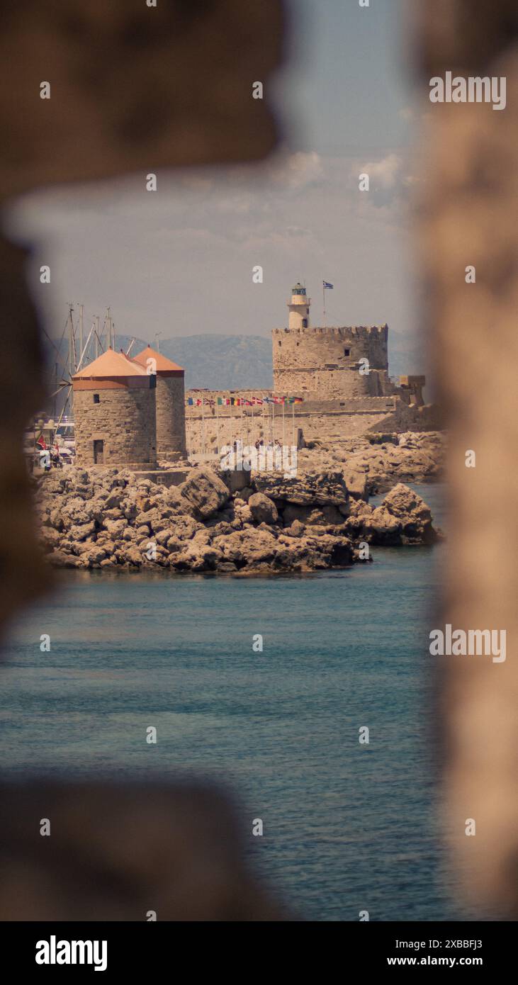 Framed View of Mandraki Harbor, Rhodes: A Glimpse of History Stock ...
