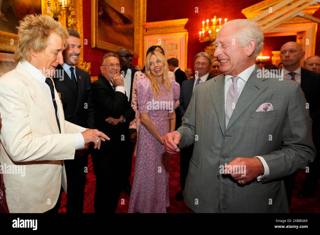 Rod Stewart (left), David Beckham (second left), and Sienna Miller (centre) speak to King ...