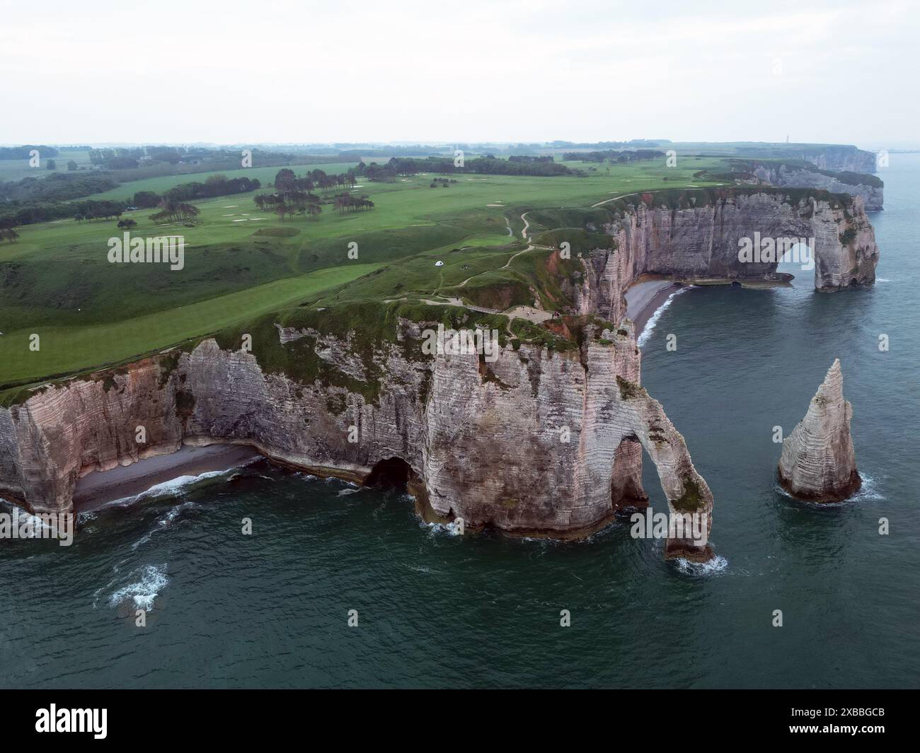Aerial view of the famous white limestone cliffs near Etretat during ...